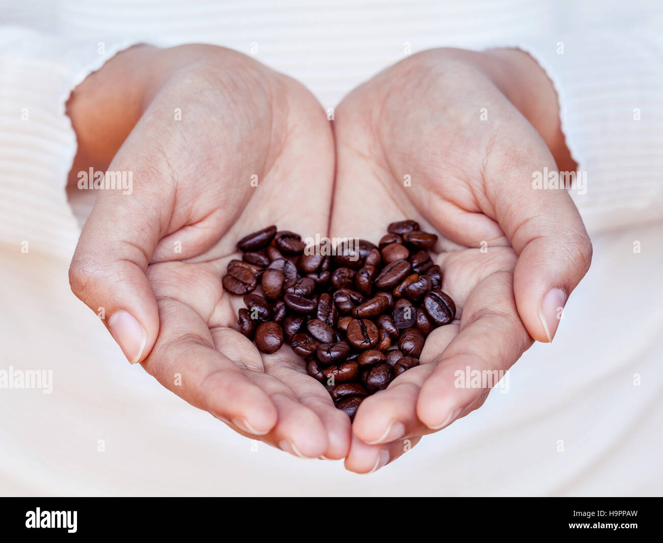 Hand of women holding coffee beans . - Concept for giving refres Stock ...