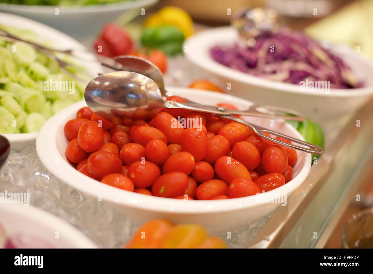 Sweet tomatoes in restaurant buffet Stock Photo - Alamy