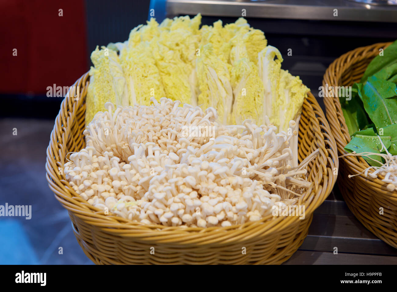Enoki mushrooms types in the basket Stock Photo - Alamy