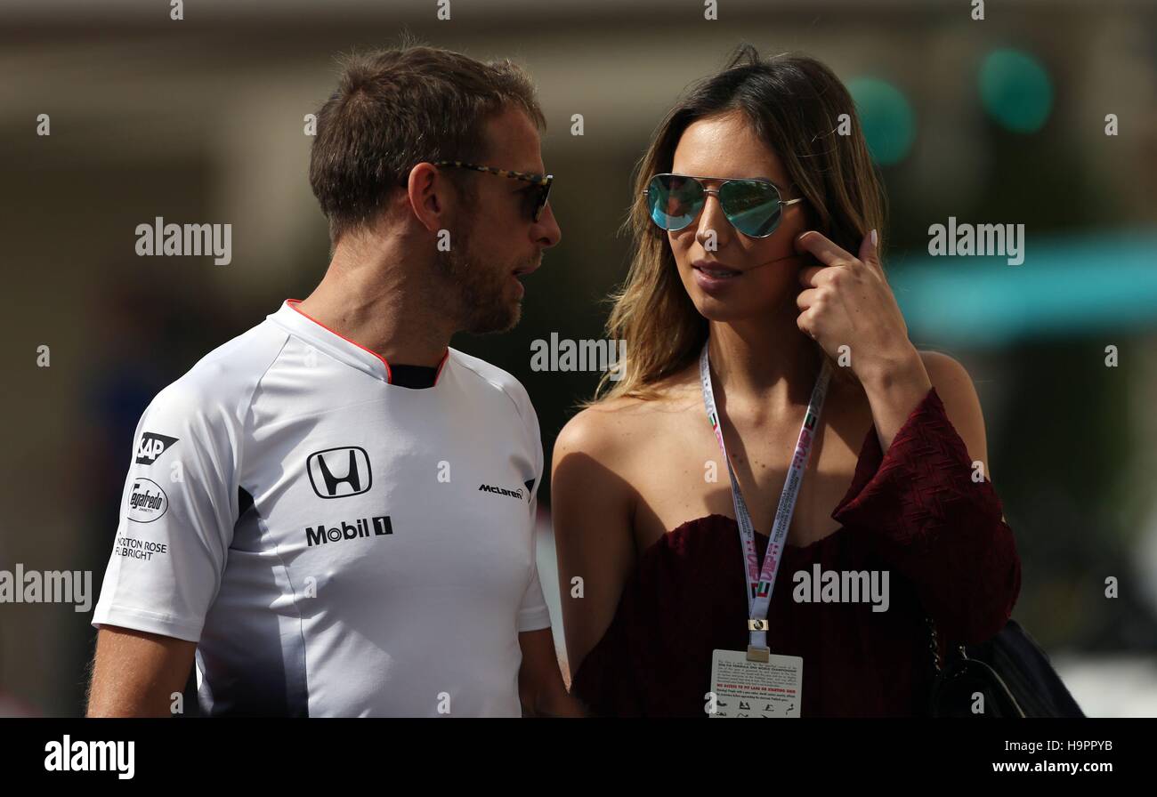 McLaren Honda driver Jenson Button arrives at the circuit with his ...