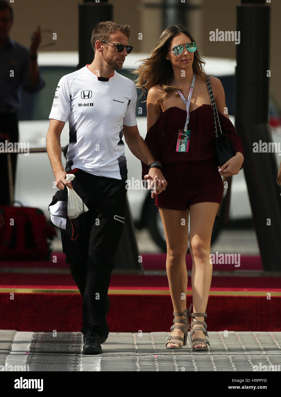 McLaren Honda driver Jenson Button arrives at the circuit with his ...