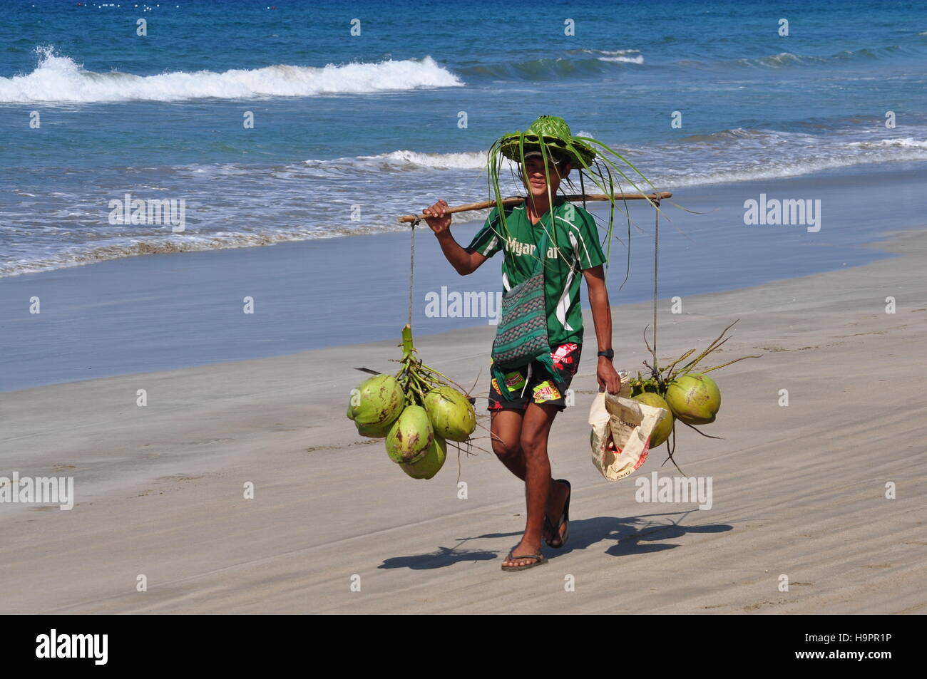 Coconut boy on Ngwesaung beach, Ngwe Saung, Gulf of Bengal, Myanmar ...
