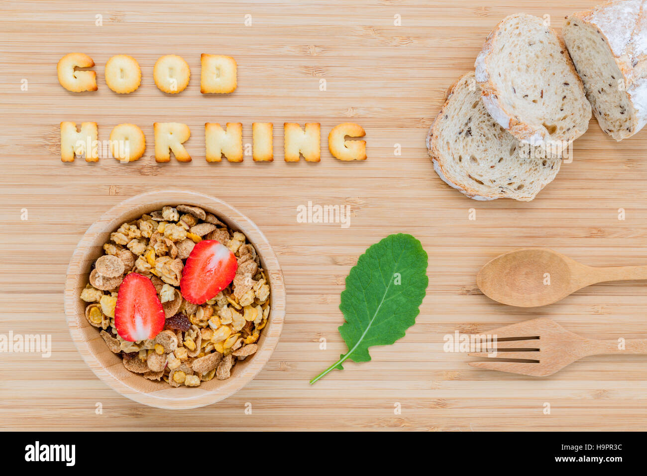 Good morning concept - Cereal in wooden bowl with strawberry and Stock ...