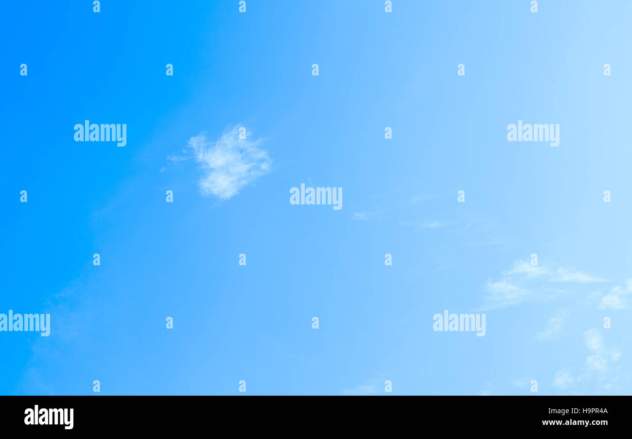Mostly clear sky with small nice white cloud Stock Photo - Alamy