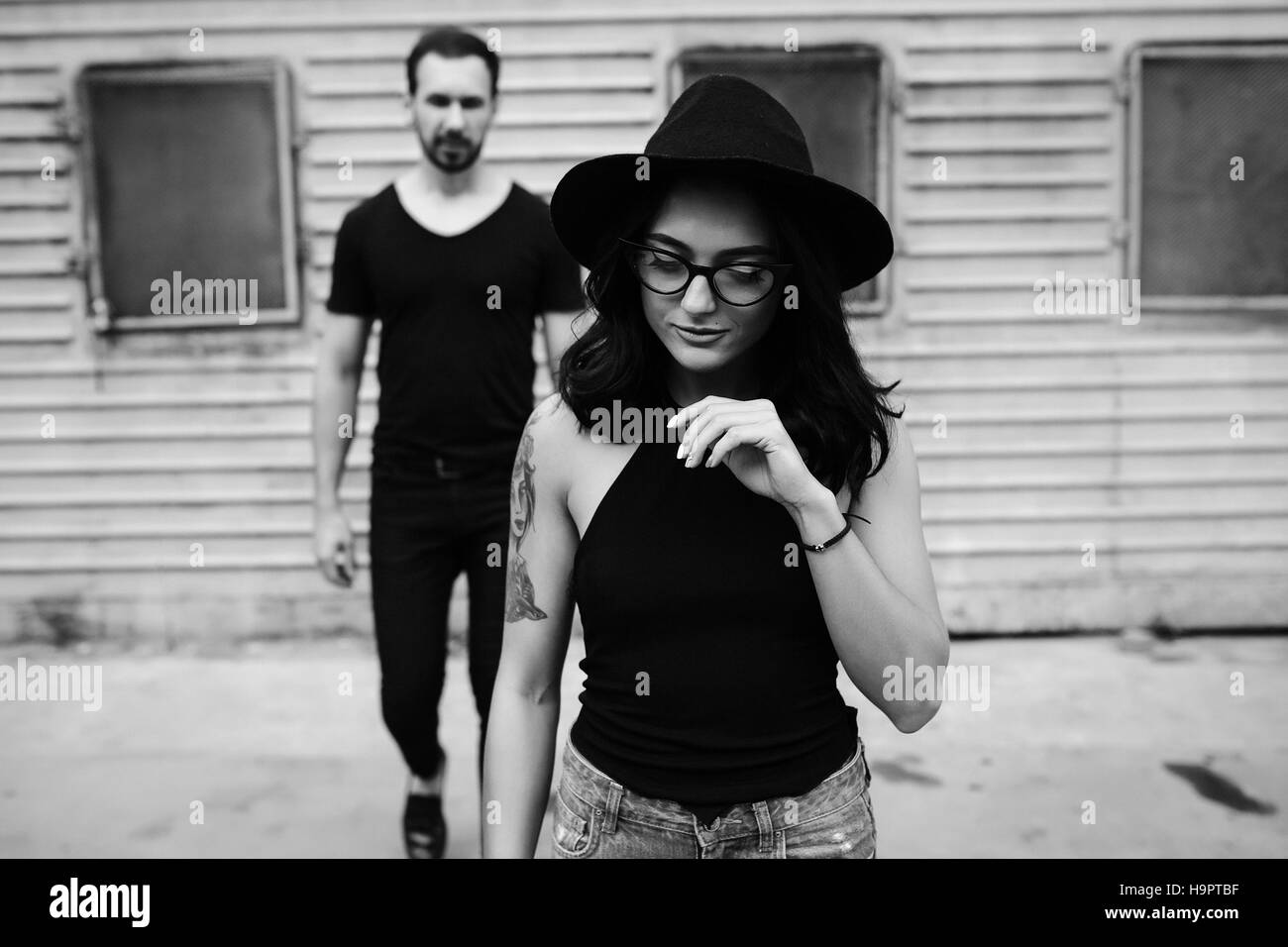guy comes up to the girl from the back Stock Photo - Alamy