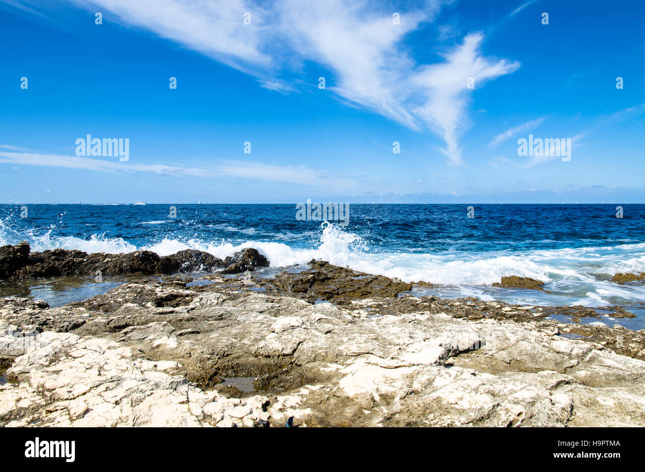 blue ocean and rocky shore view Stock Photo - Alamy