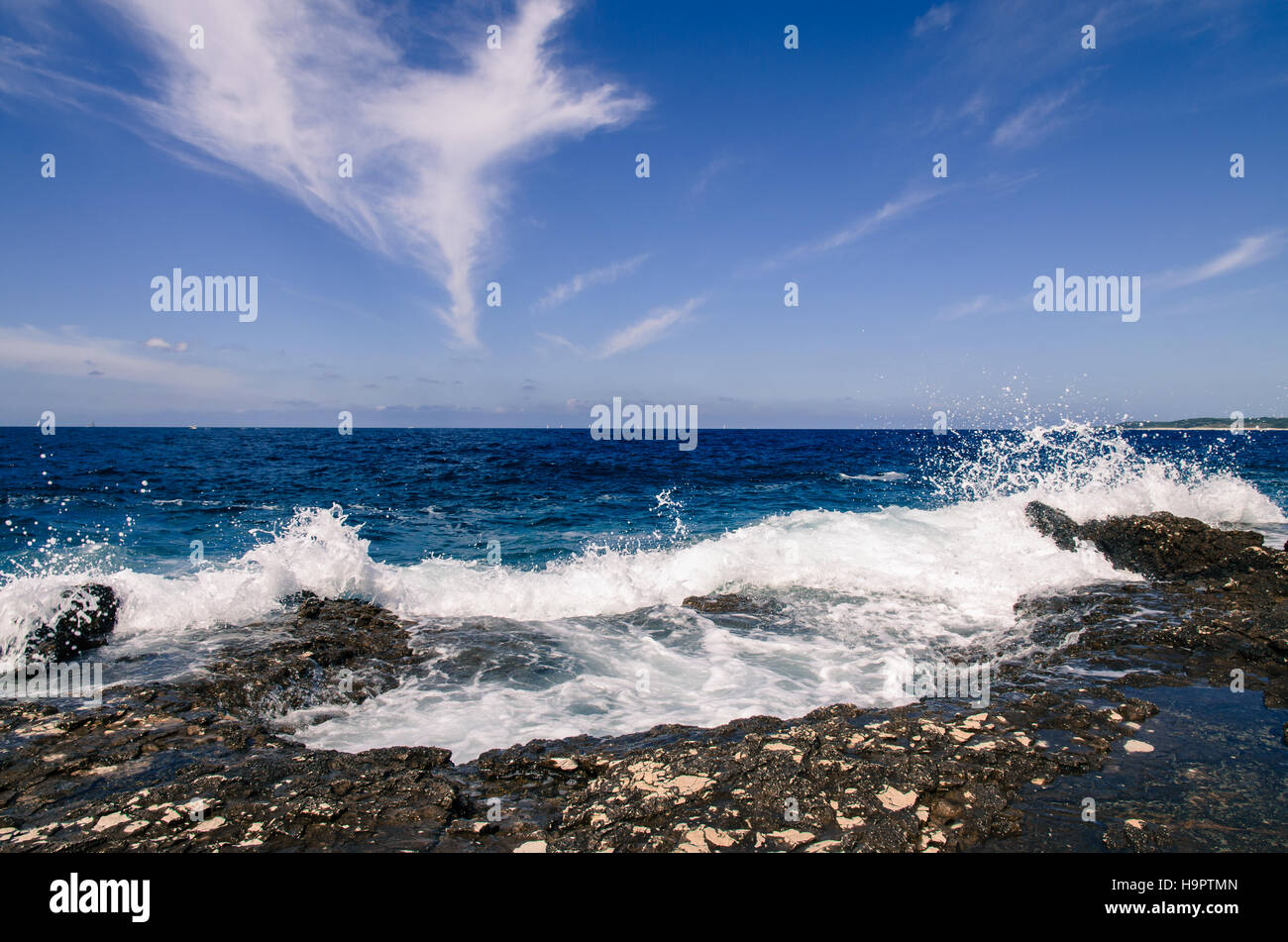 water splash and blue ocean and rocky shore Stock Photo - Alamy