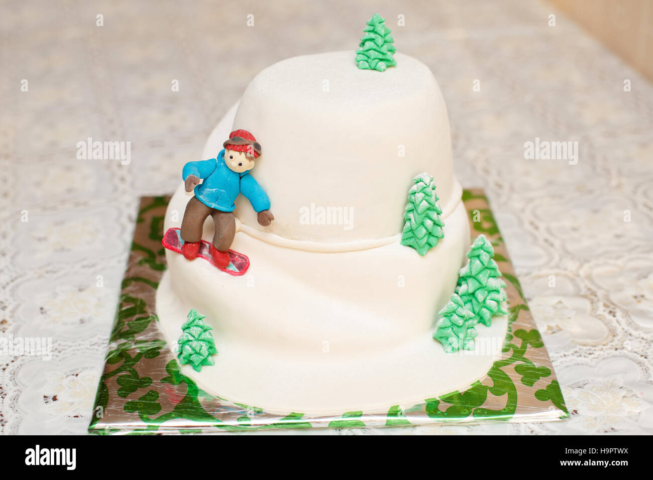 Mastic cake in mountain form with skier Stock Photo - Alamy
