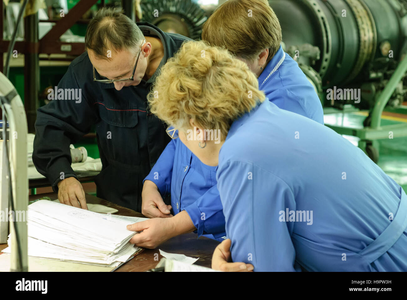 industrial quality control over factory background Stock Photo - Alamy