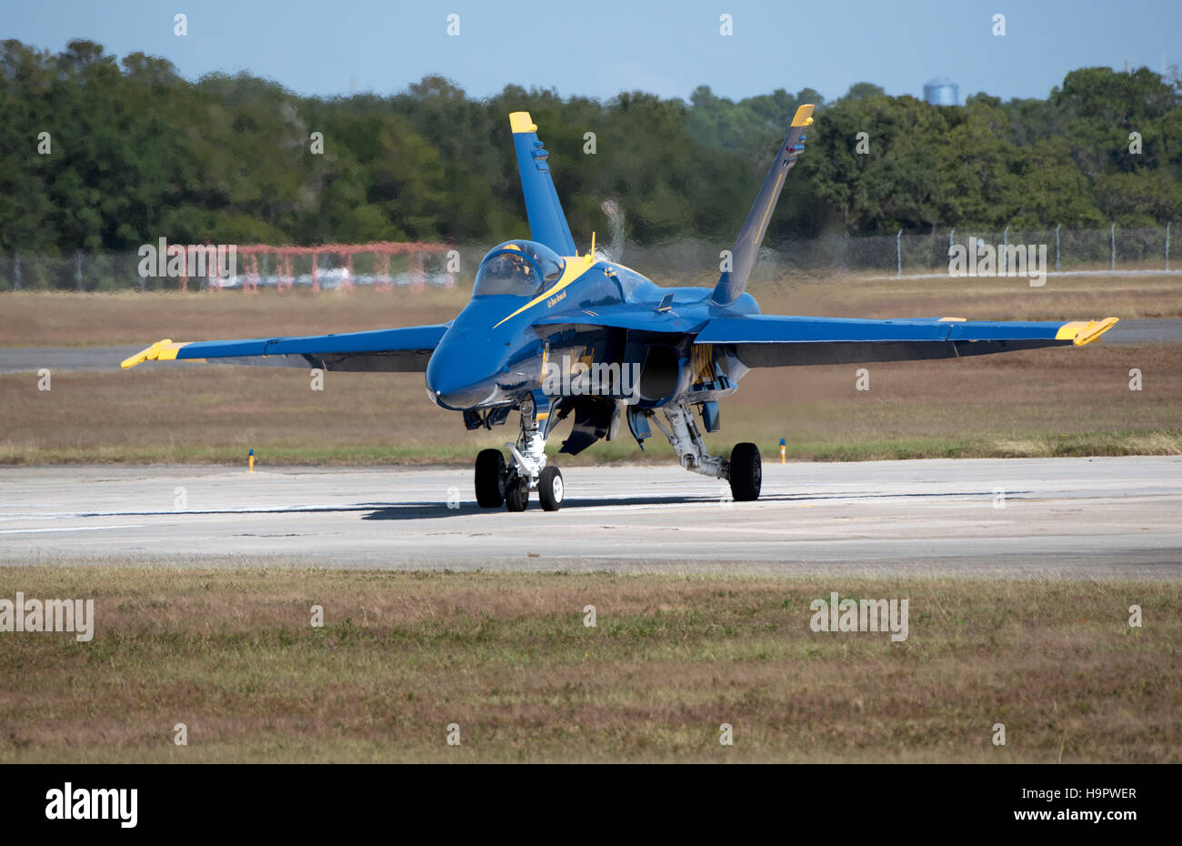 Military Hornet fighter jet preparing for take of from a runway at ...