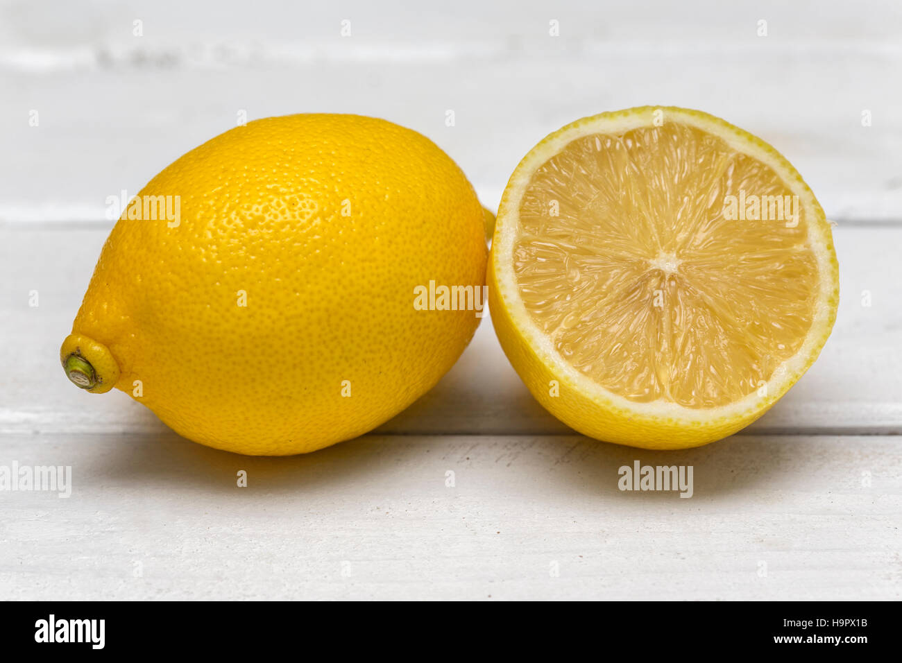 Group of fresh lemon on an old vintage wooden table Stock Photo - Alamy