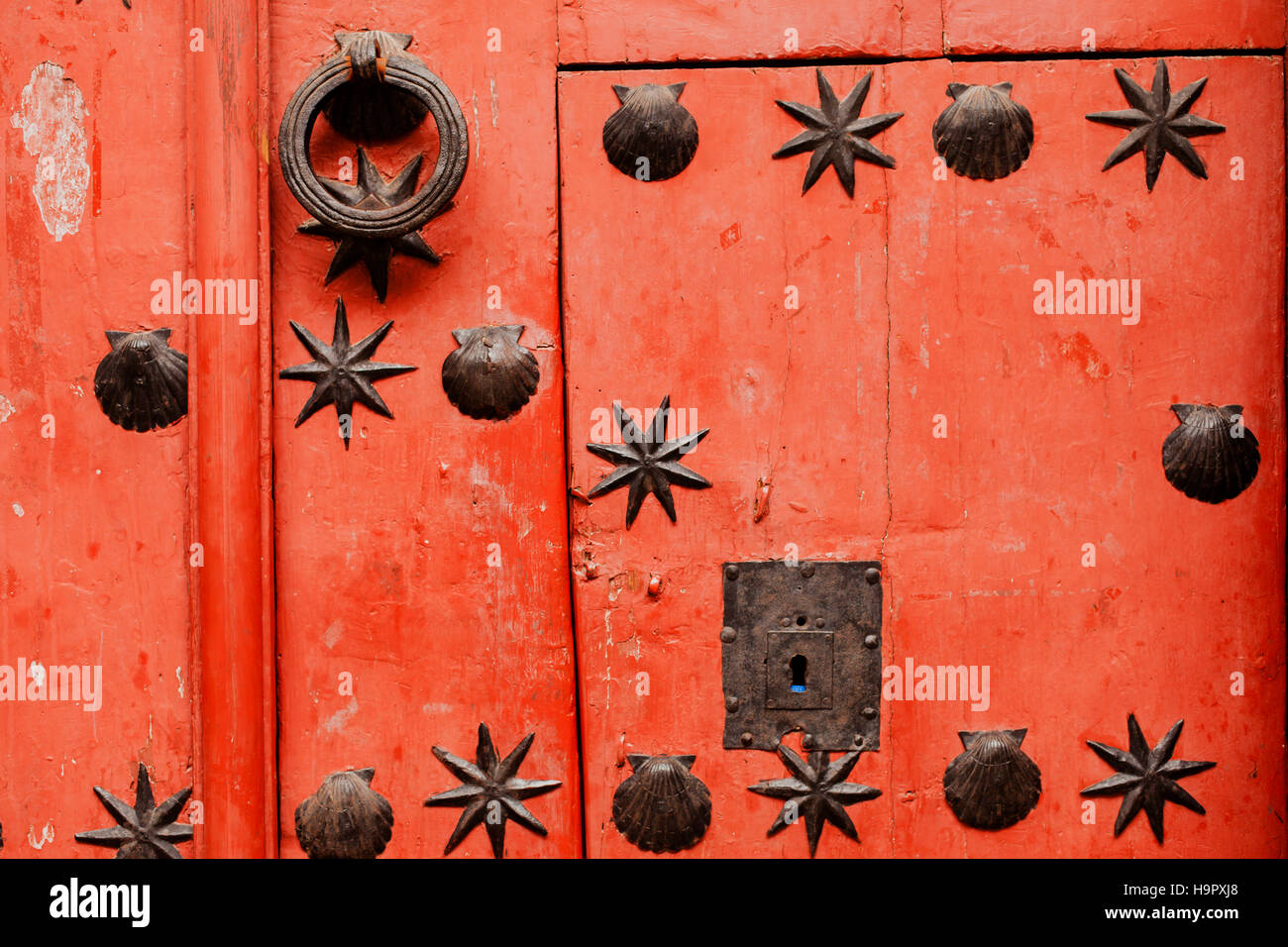 Nice old door with wrought iron decoration Stock Photo - Alamy