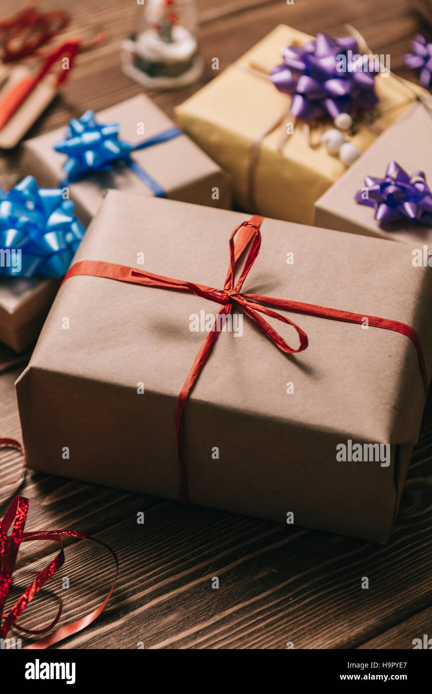 Close up present wrapped in craft paper Stock Photo - Alamy