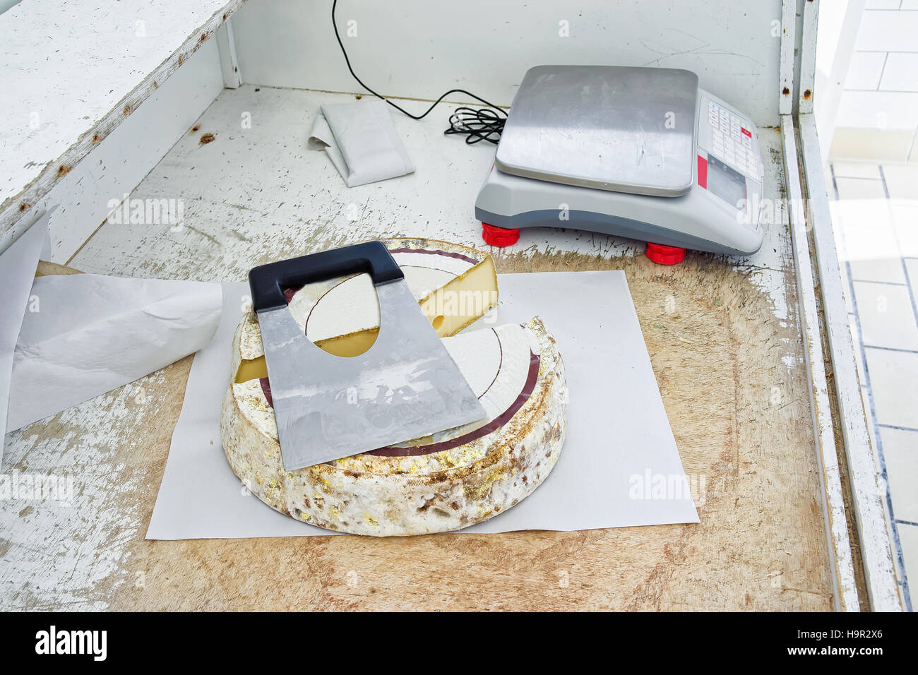 Aging Cheese cut with knife at Franch Comte dairy, Burgundy, France ...