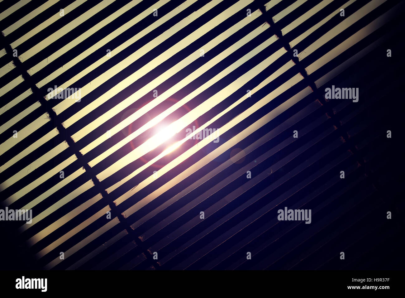 the sun is shining through the blinds Stock Photo - Alamy