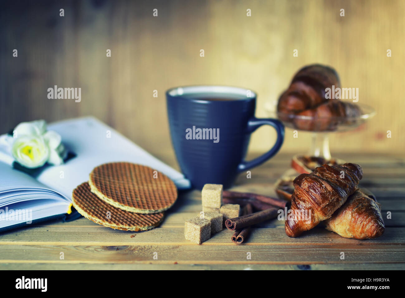 tea cup croissant book Stock Photo - Alamy