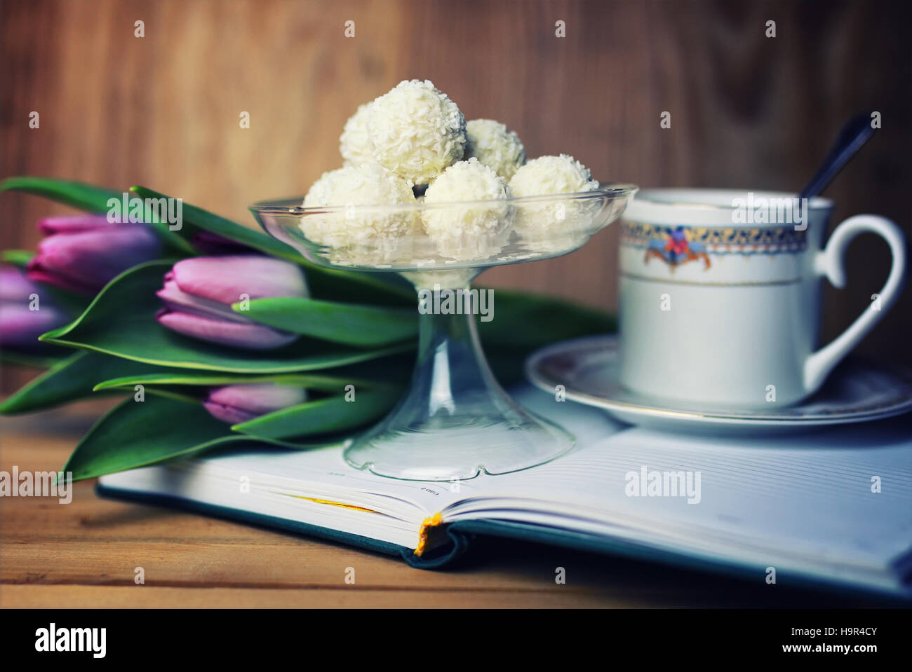 reading book with tea flower and sweet Stock Photo - Alamy