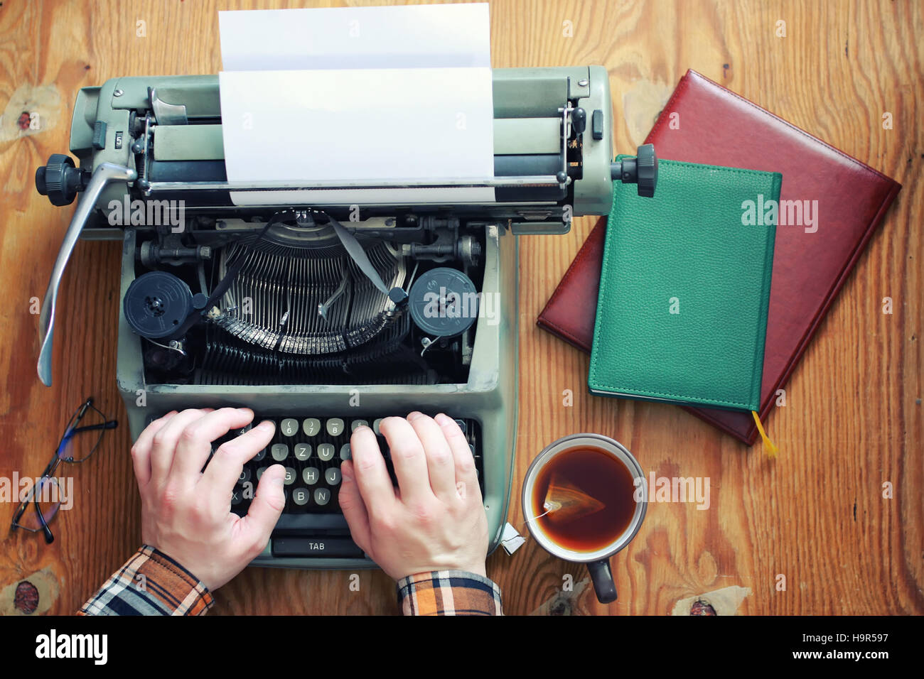 typewriter retro hand on wooden table Stock Photo - Alamy