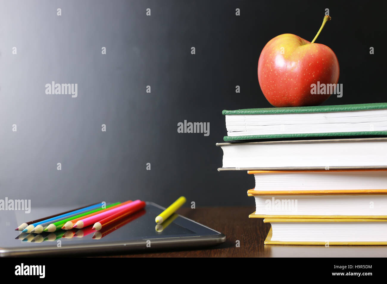 Education an apple and books Stock Photo - Alamy
