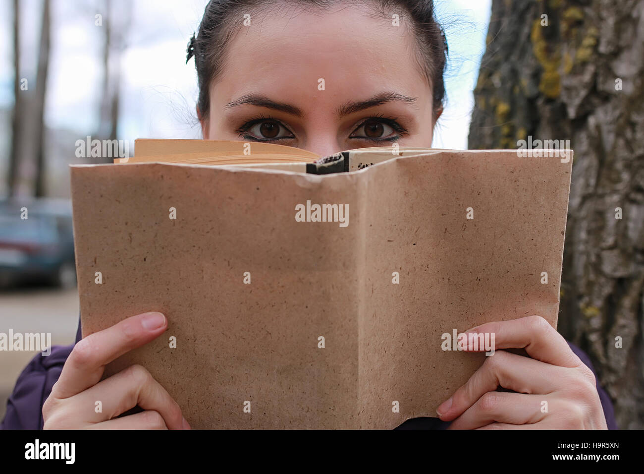 woman with book tree winter outdoor Stock Photo - Alamy