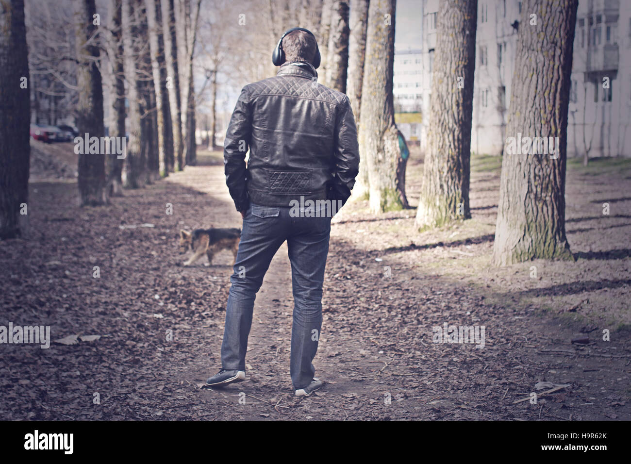 retro toned effected photo of alone man on street Stock Photo - Alamy