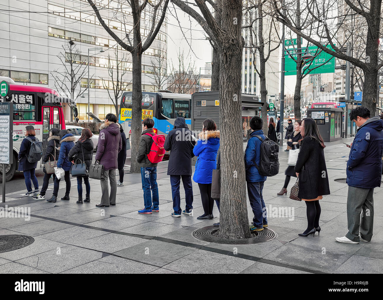 Seoul, South Korea - March 11, 2016: People staying in the queue ...