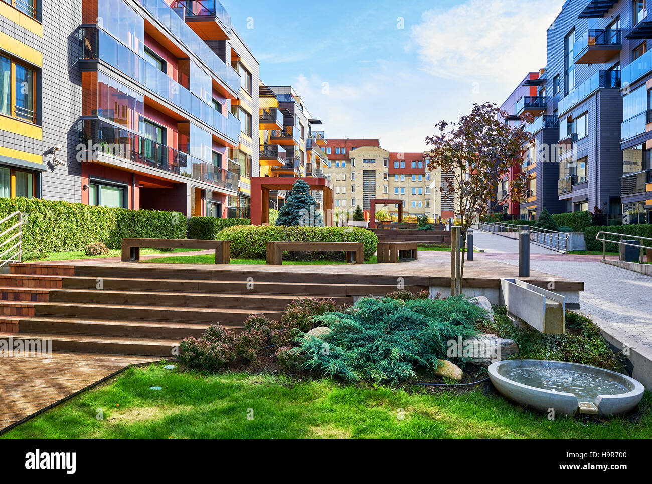 Modern complex of apartment residential buildings and decorative water ...