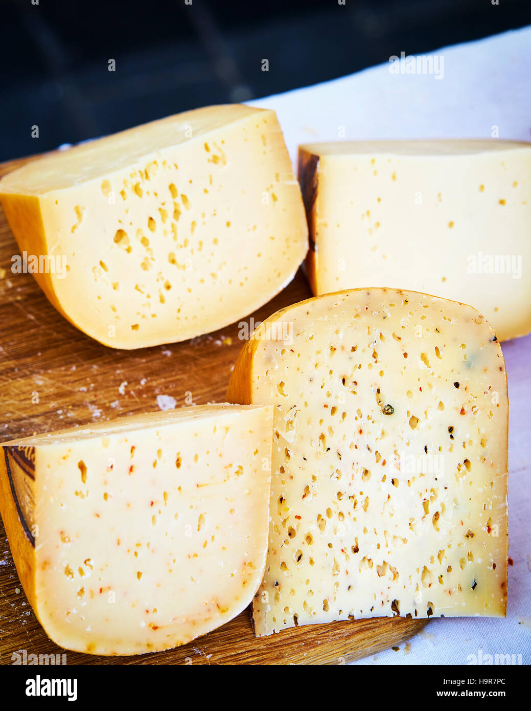 Slabs of Cheese with holes Stock Photo - Alamy