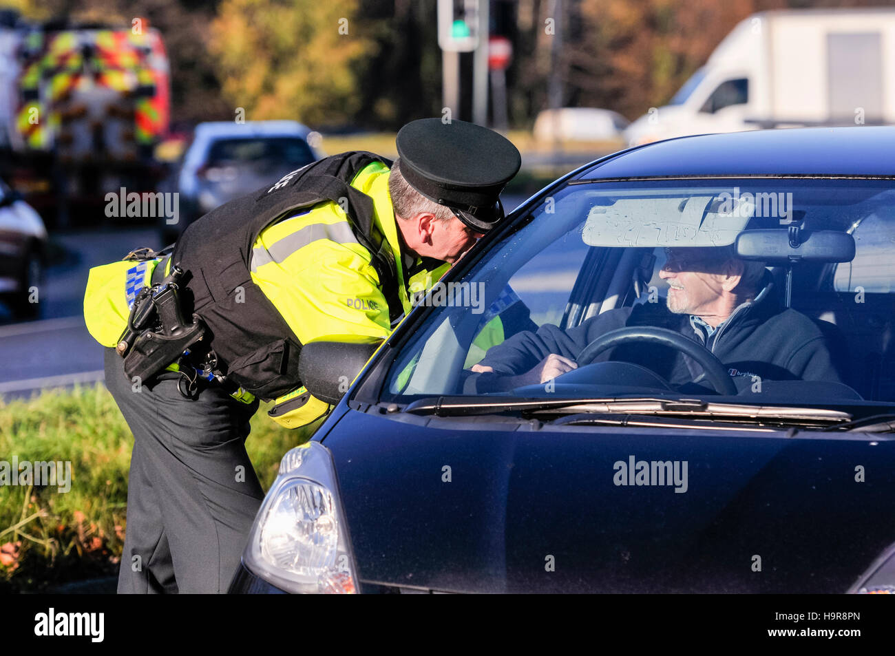 Belfast, Northern Ireland. 24 Nov 2016 - An armed PSNI officer talks to ...