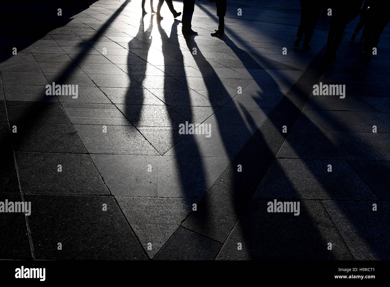 The morning sun creates long shadows in the Domplatte square in front ...