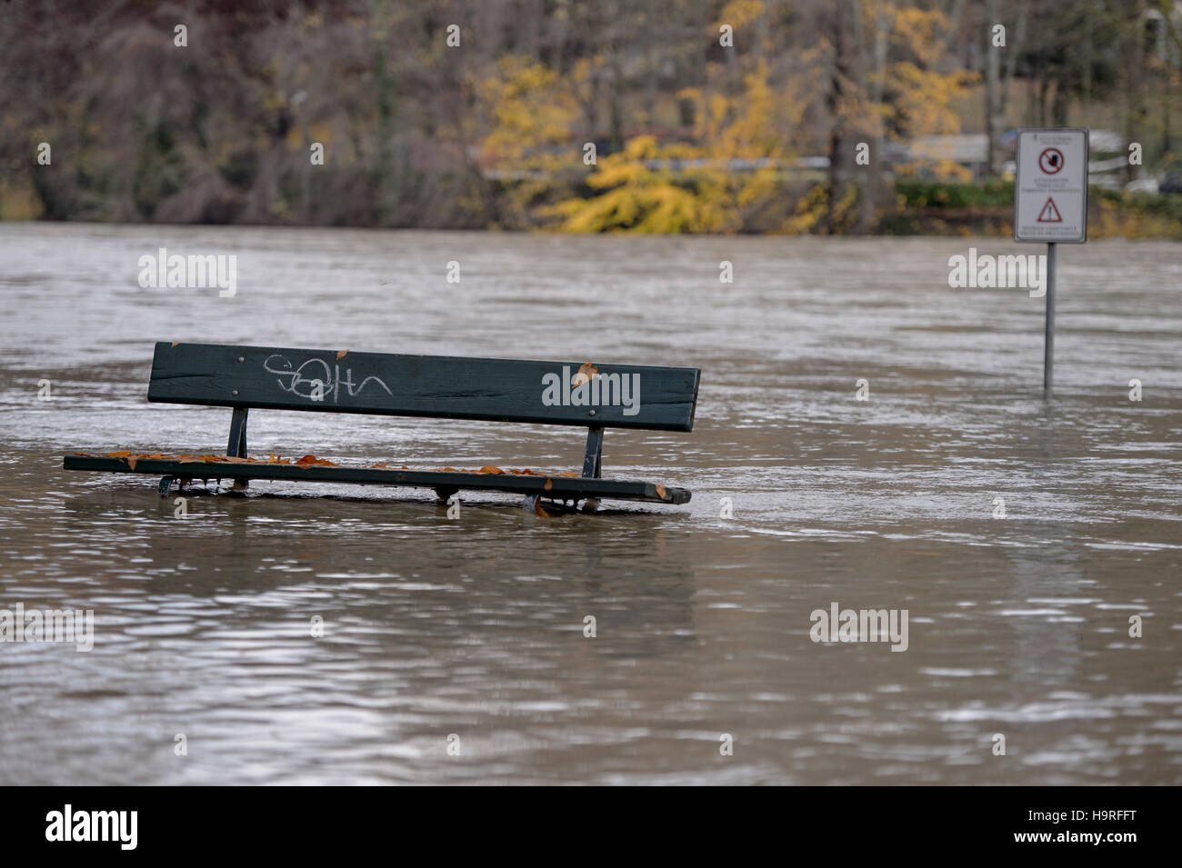 Turin, Italy. 25 november 2016: A bench is submerged in the water after ...