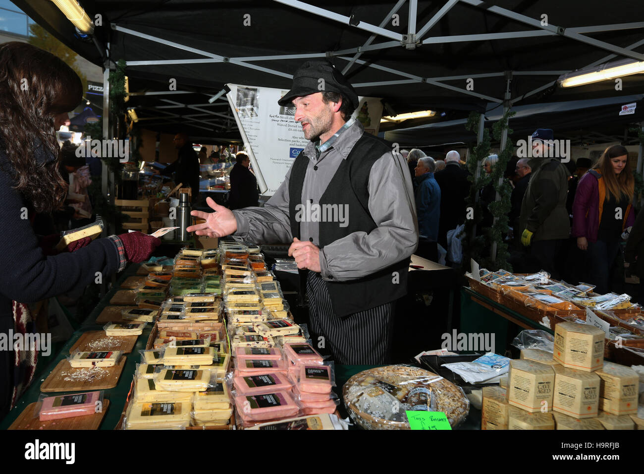 Salford Quays, UK. 25th November, 2016. A Cheese seller on a stall at ...