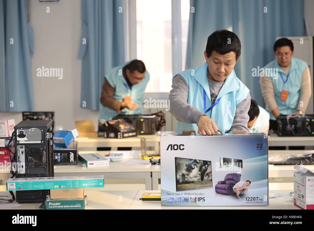 Tianjin, China. 26th Nov, 2016. Young people take part in a computer ...