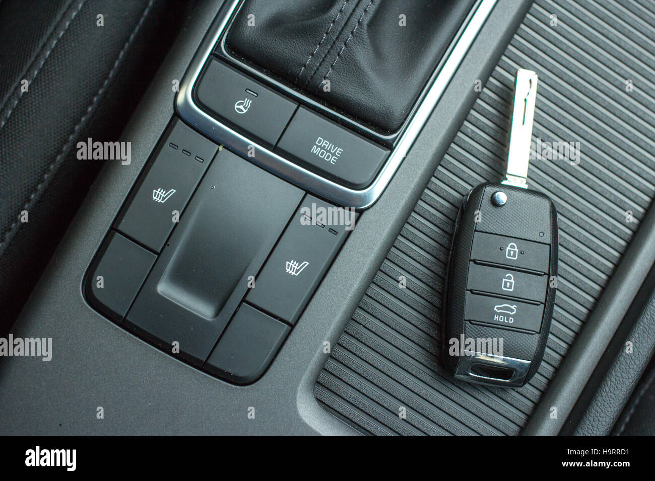 Modern Car remote control key in vehicle interior Stock Photo - Alamy