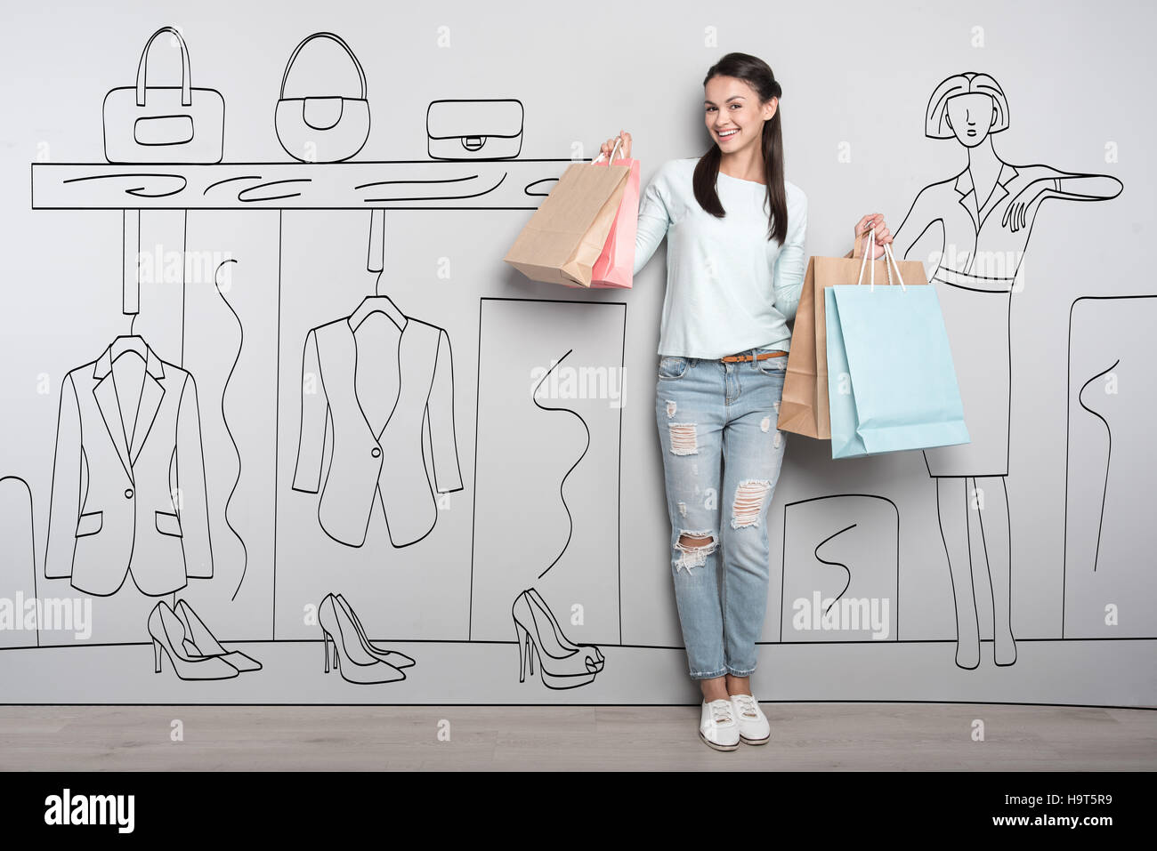 Joyful woman posing after shopping Stock Photo - Alamy
