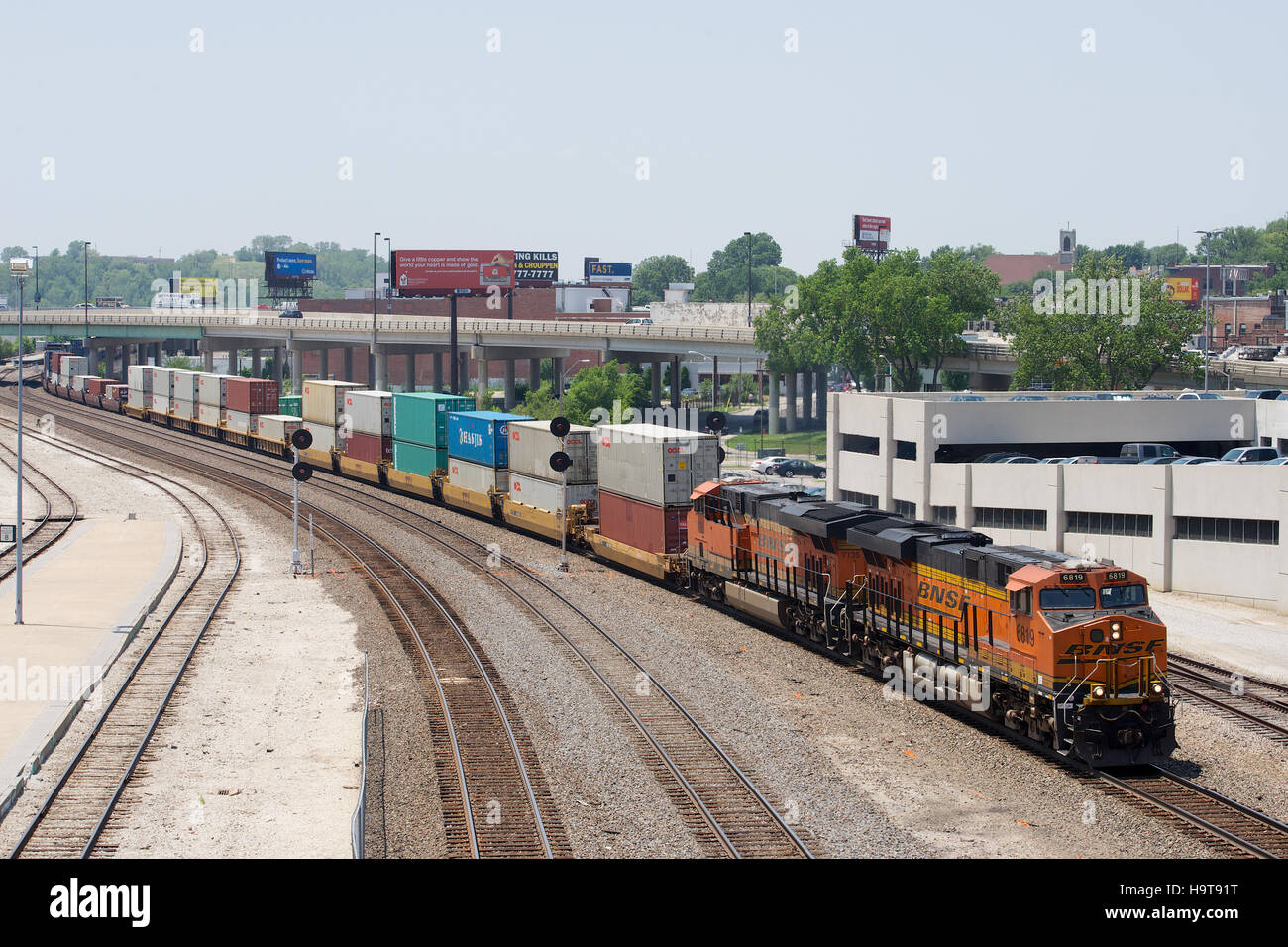 BNSF operated intermodal double-stack train heads through Union Station ...