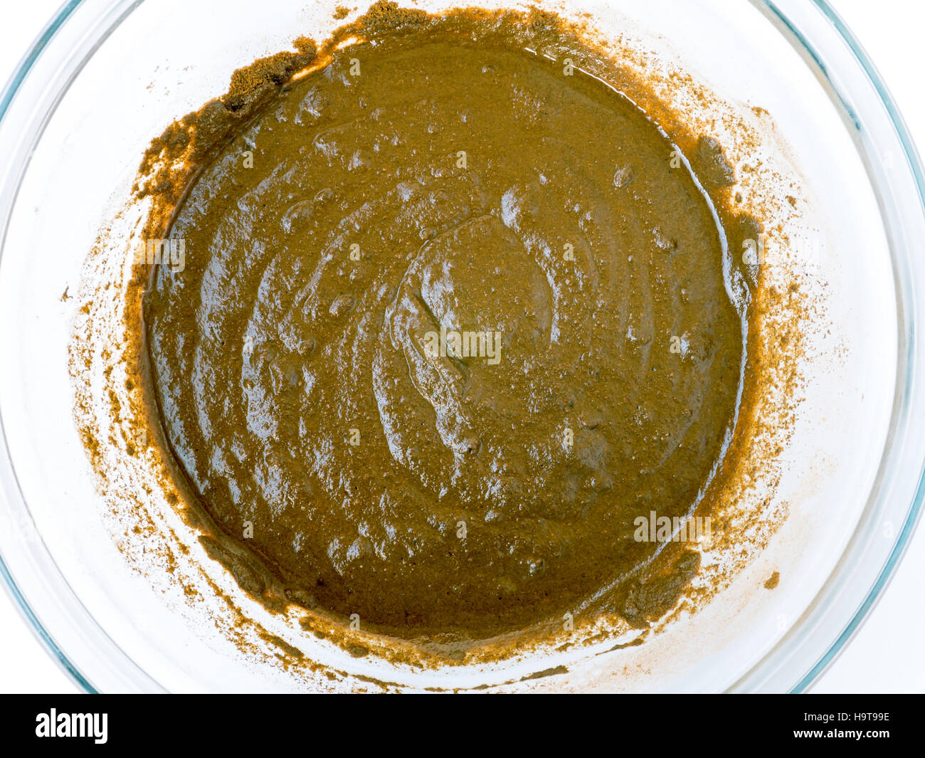 Henna mixed in the glass bowl dye release Stock Photo - Alamy