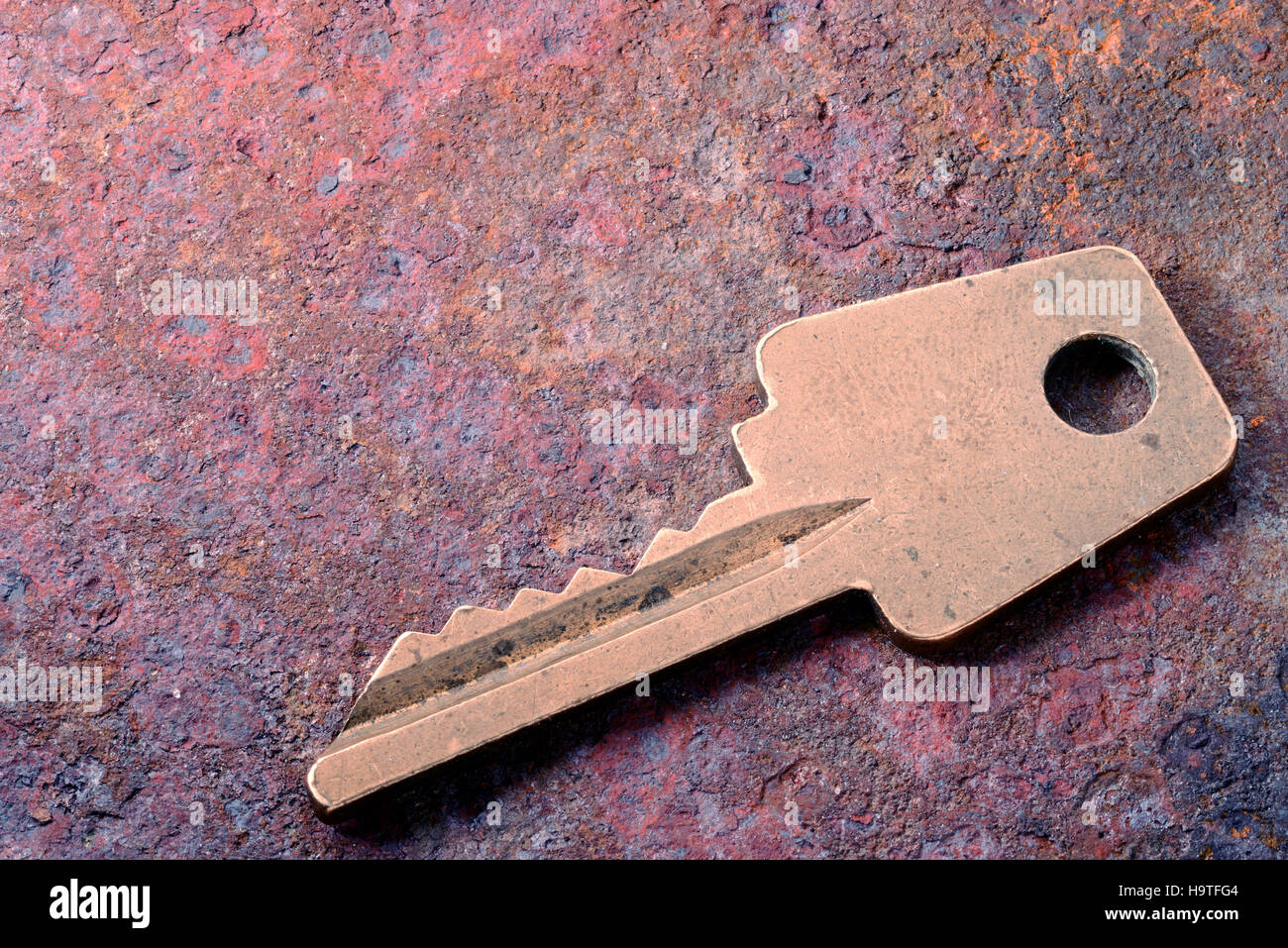 vintage door key on old rusty metallic surface Stock Photo - Alamy