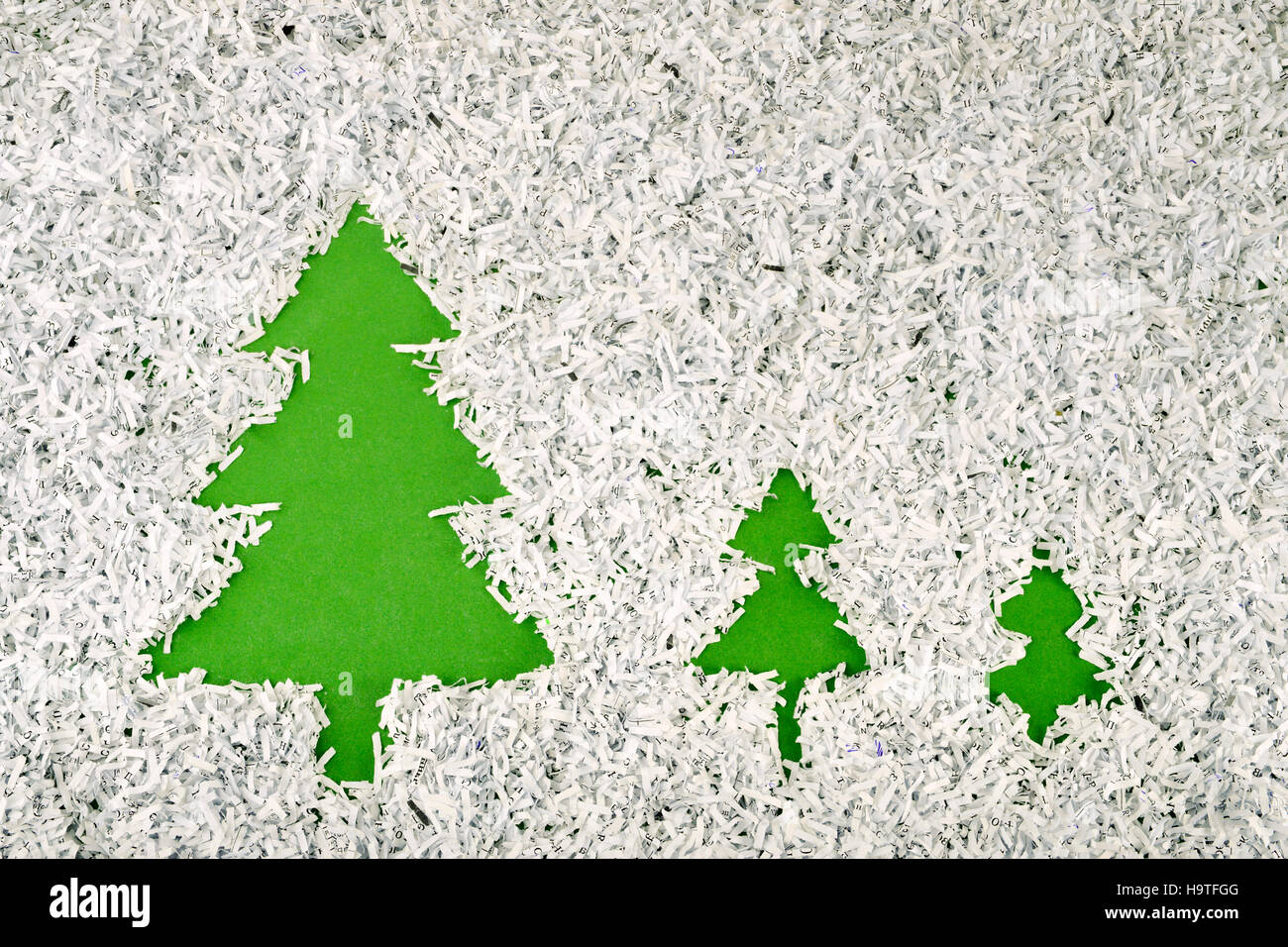 three green fir symbols made inside big heap of shredded paper Stock ...