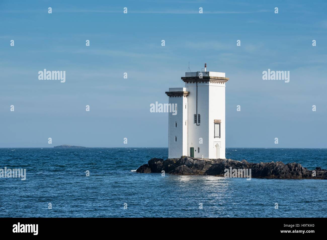 Lighthouse at Port Ellen on the headland Carraig Fhada, Isle of Islay ...