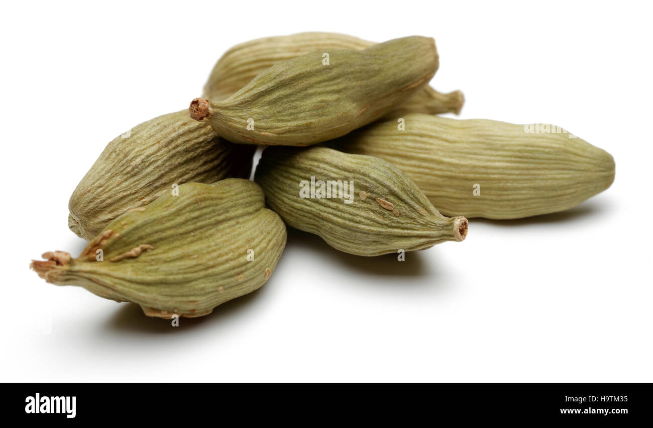 Cardamom seeds on a white background Stock Photo - Alamy