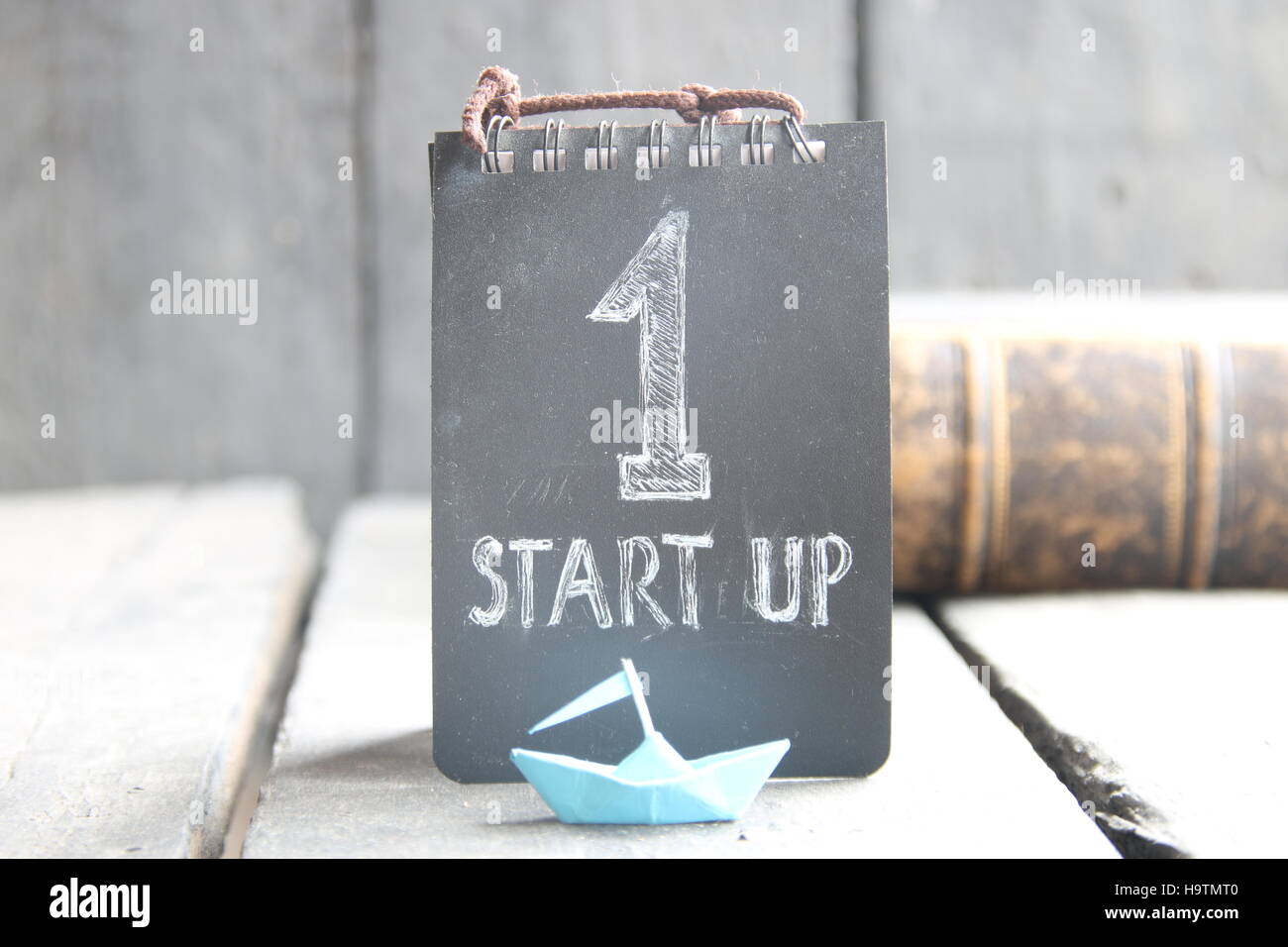 smart start up, success concept, text and paper boat Stock Photo - Alamy