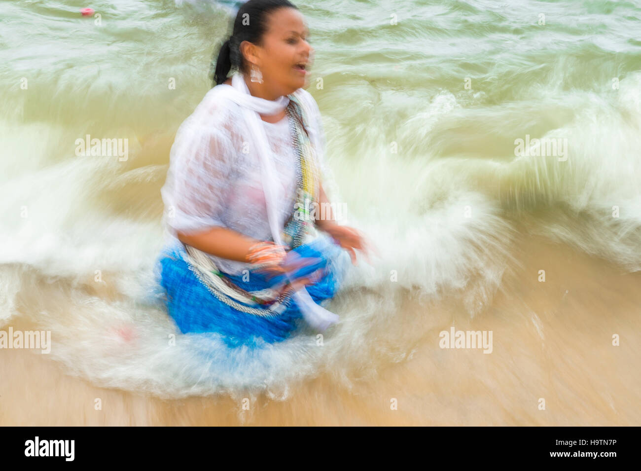 Woman wading in water in a dress hi-res stock photography and images ...