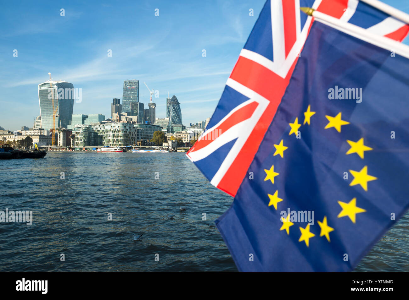 European Union and Union Jack flags flying over the London skyline of ...