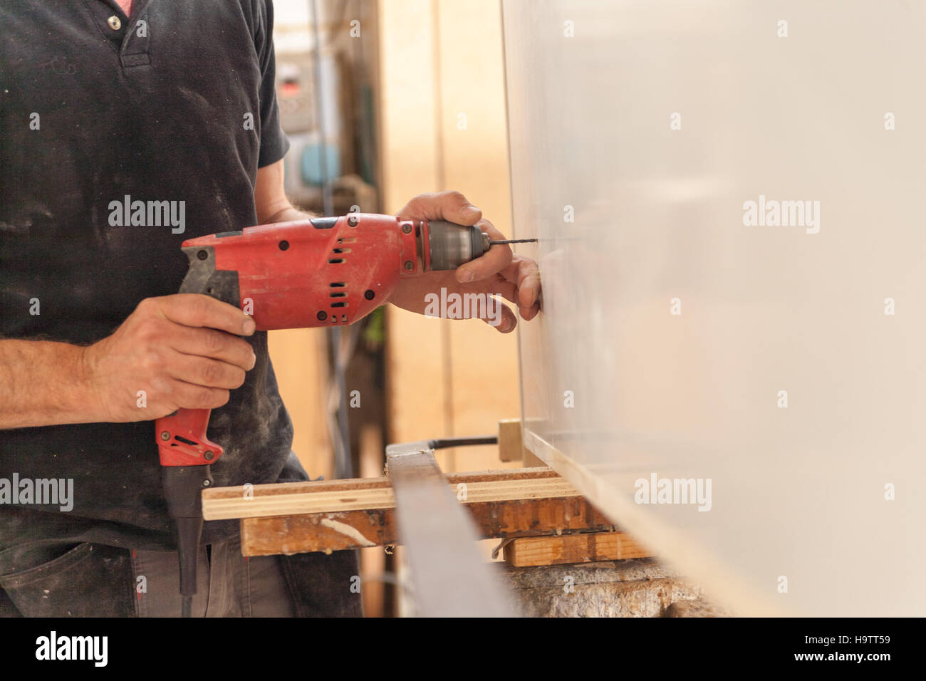 hands of a woodworker drilling some furniture he's making Stock Photo ...