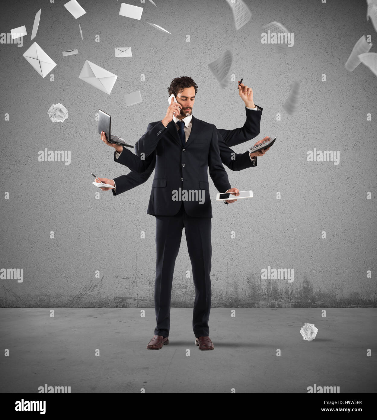 Businessman multitasking hi-res stock photography and images - Alamy