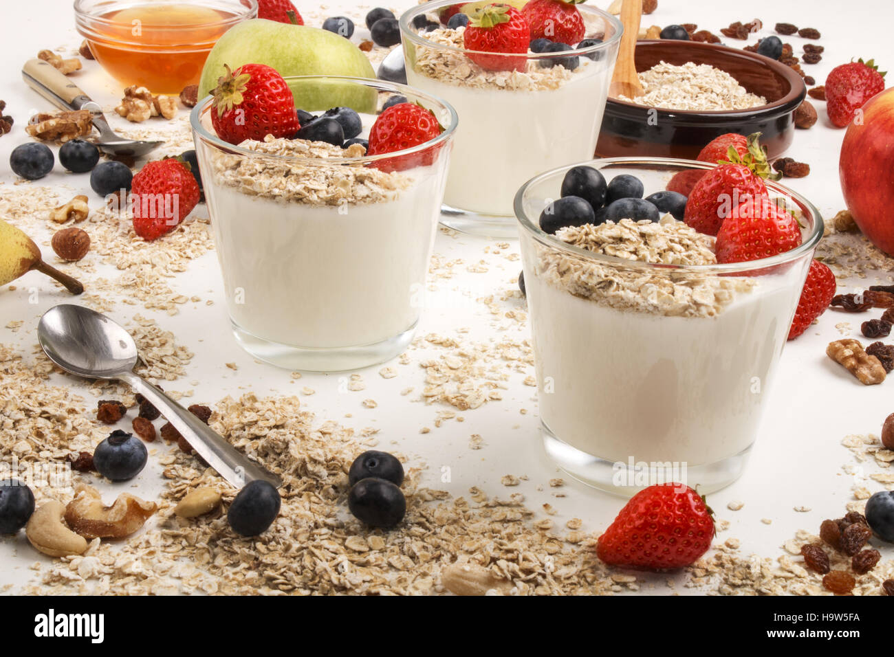 healthy breakfast with yogurt, strawberry, blueberry, apple, pear and ...