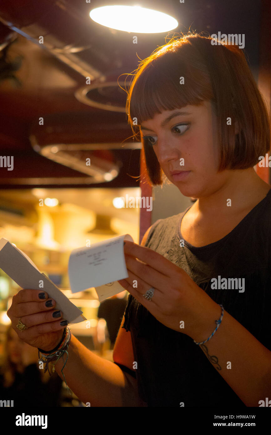 Checking the bill Stock Photo - Alamy
