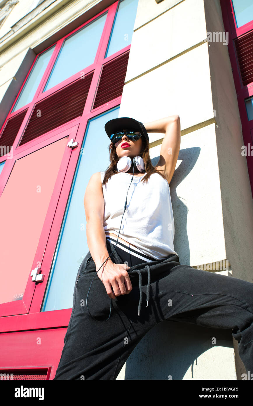 A beautiful young Hip Hop Rapper girl with Headphones in a urban ...