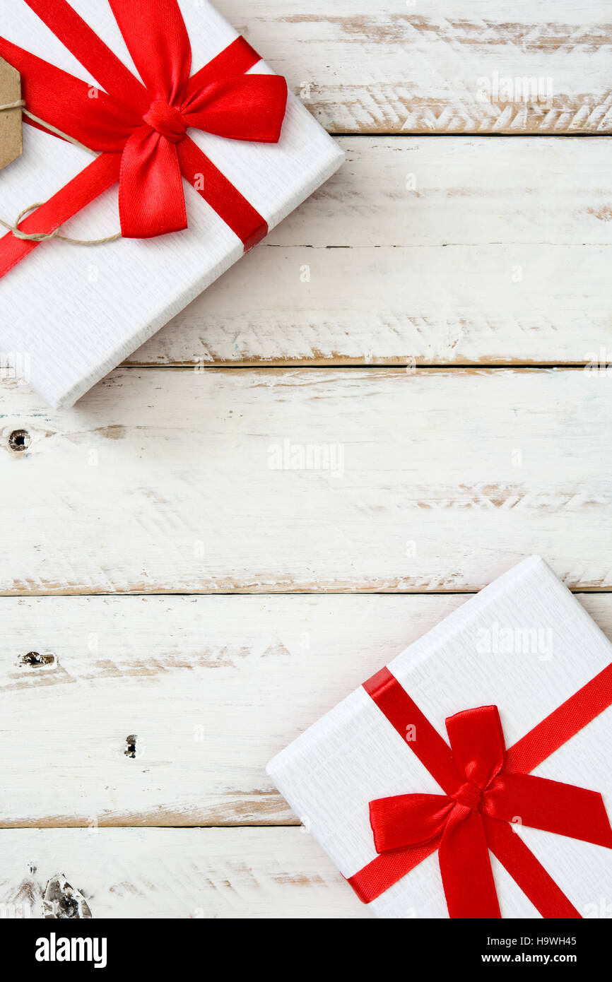 White gift box on white wooden background Stock Photo - Alamy